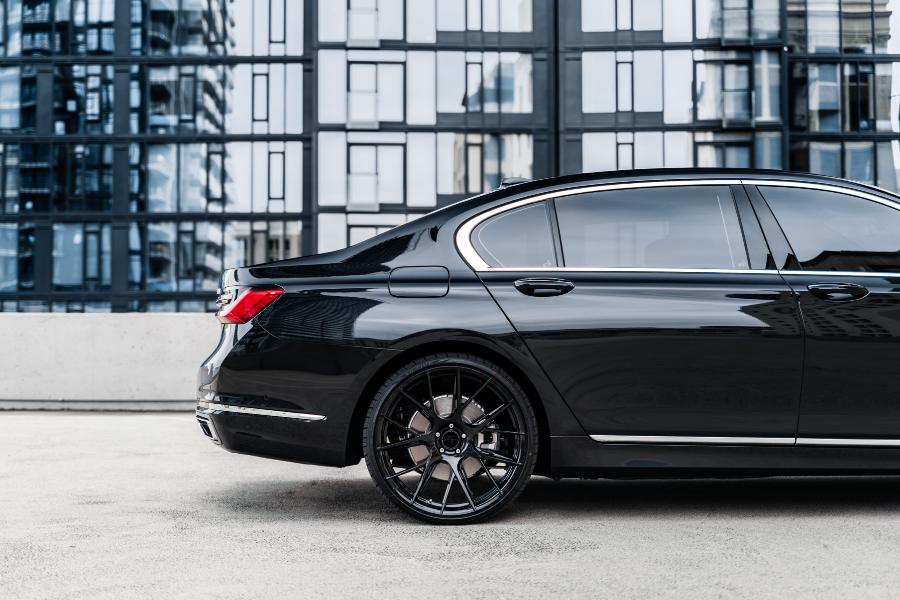 A 2020 BMW 740i on 20 Inch Blaque Diamond BD-F18 Gloss Black Wheels ...