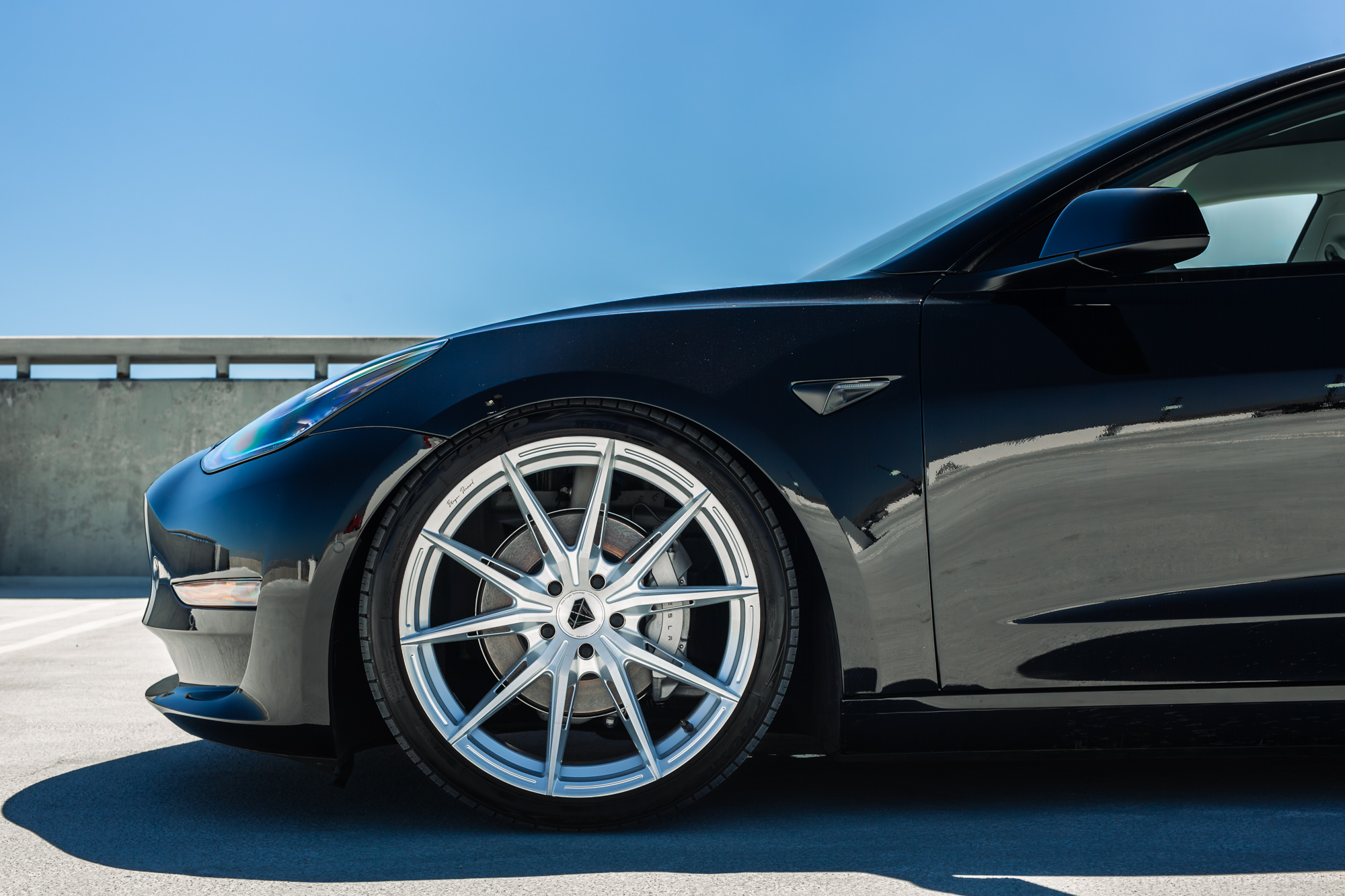 A 2022 Tesla Model 3 with Blaque Diamond BD-F29 Brushed Silver Wheels ...