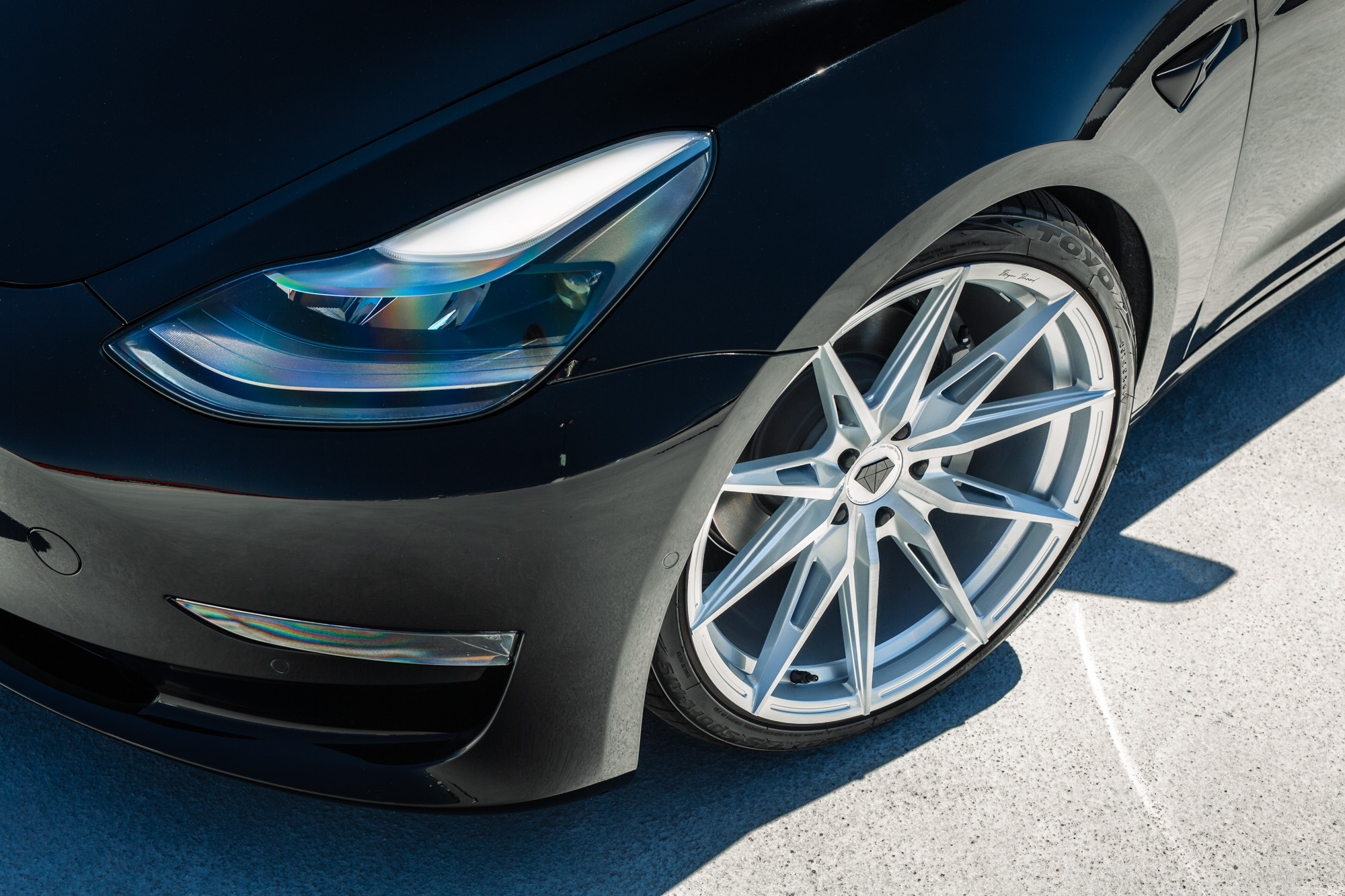 A 2022 Tesla Model 3 with Blaque Diamond BD-F29 Brushed Silver Wheels ...